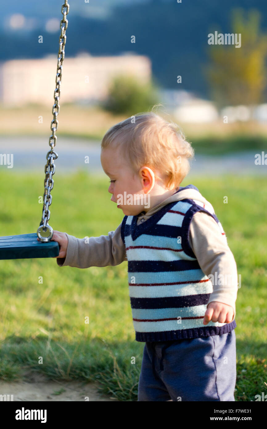 Baby plays on the playground Stock Photo - Alamy