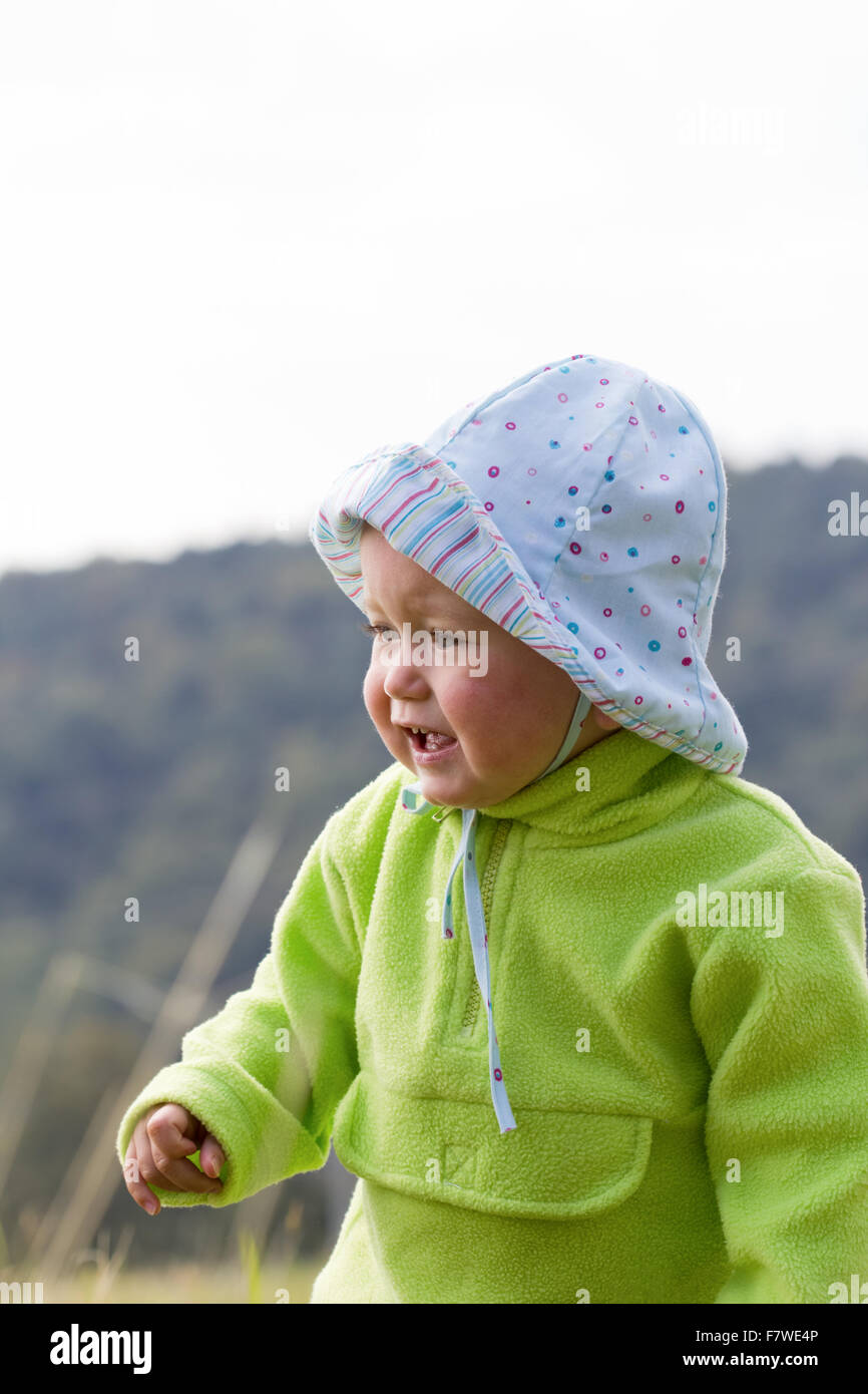 Unhappy child on the nature background Stock Photo - Alamy