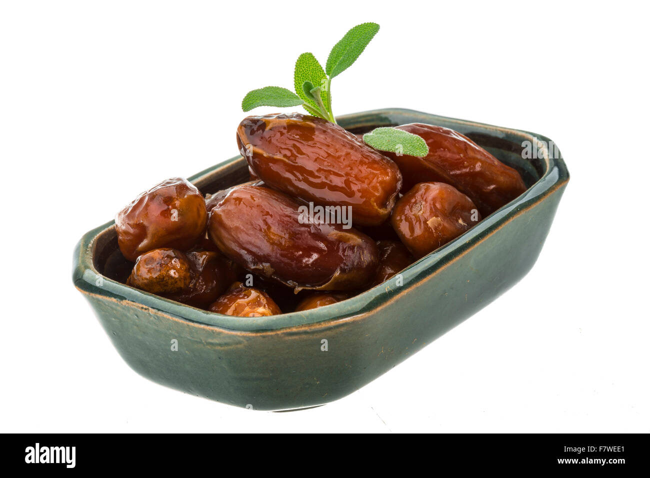 Dates with leaf on the plate Stock Photo - Alamy