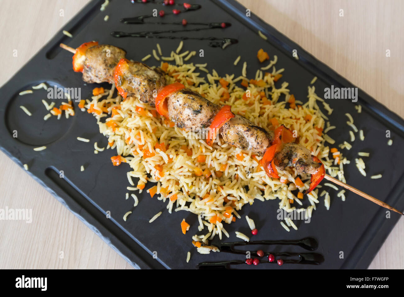 Chicken shish kebab and rice with vegetables Stock Photo - Alamy