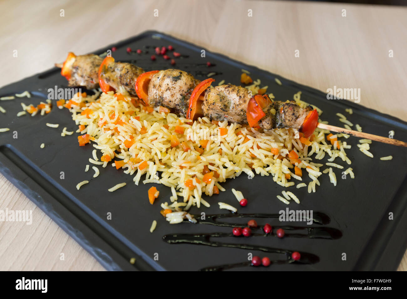 Chicken shish kebab and rice with vegetables Stock Photo - Alamy