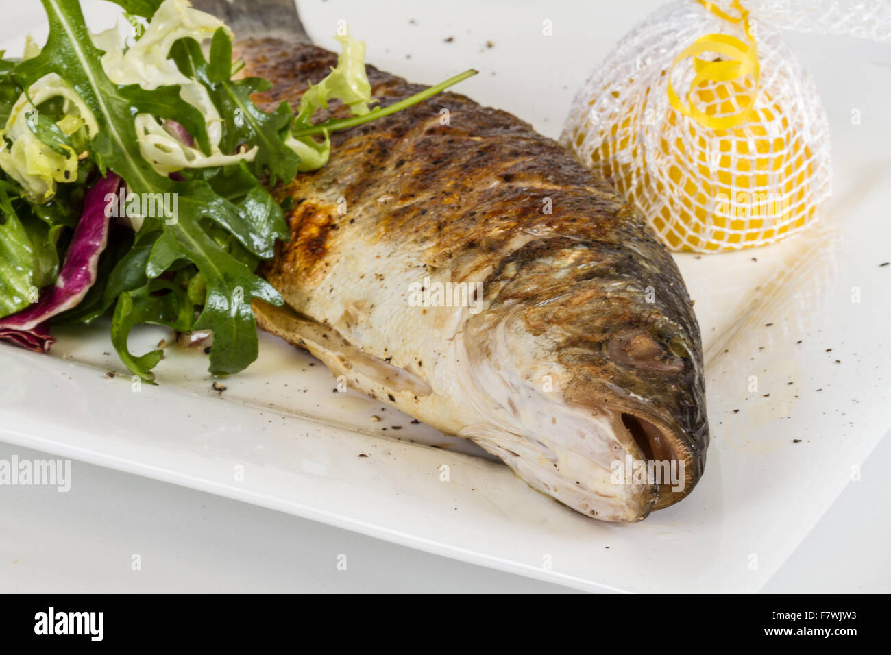 Sea-bass with vegetables Stock Photo - Alamy