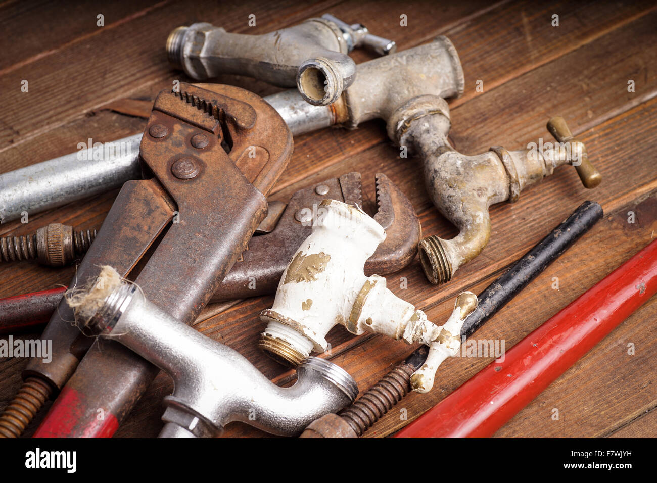 plumbing tools lying with old pipes and faucets Stock Photo - Alamy