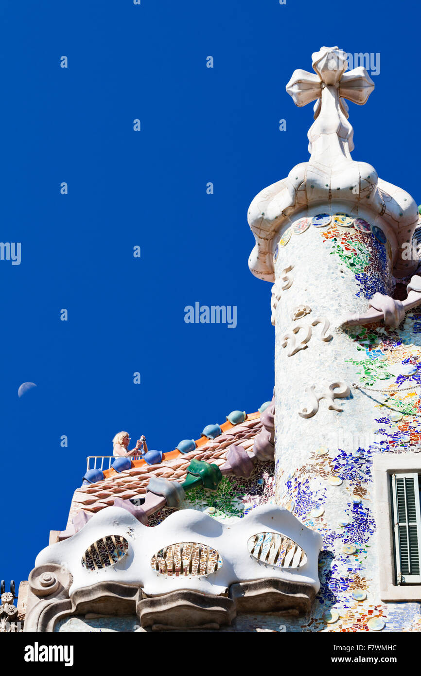 A tourist takes a picture on the rooftop of Casa Batllo house in ...