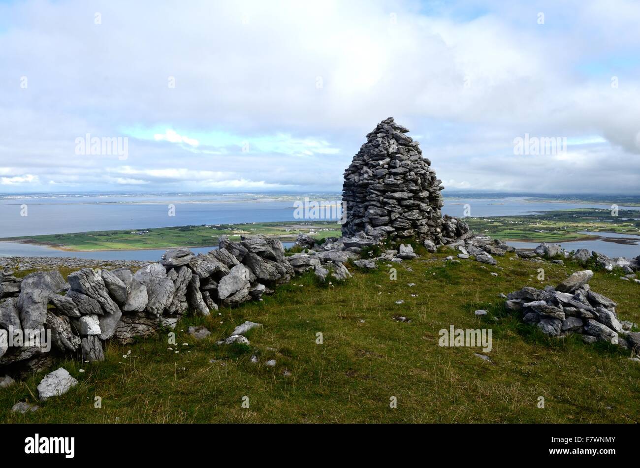conical stone cairn at the summit of Abbey Hill the Burren County Clare ...