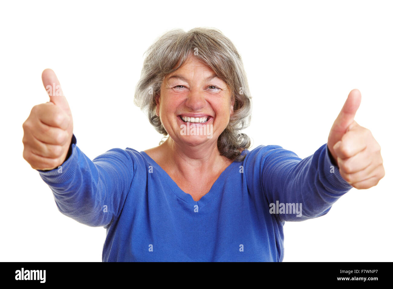 An happy senior woman showing her two thumbs up Stock Photo - Alamy