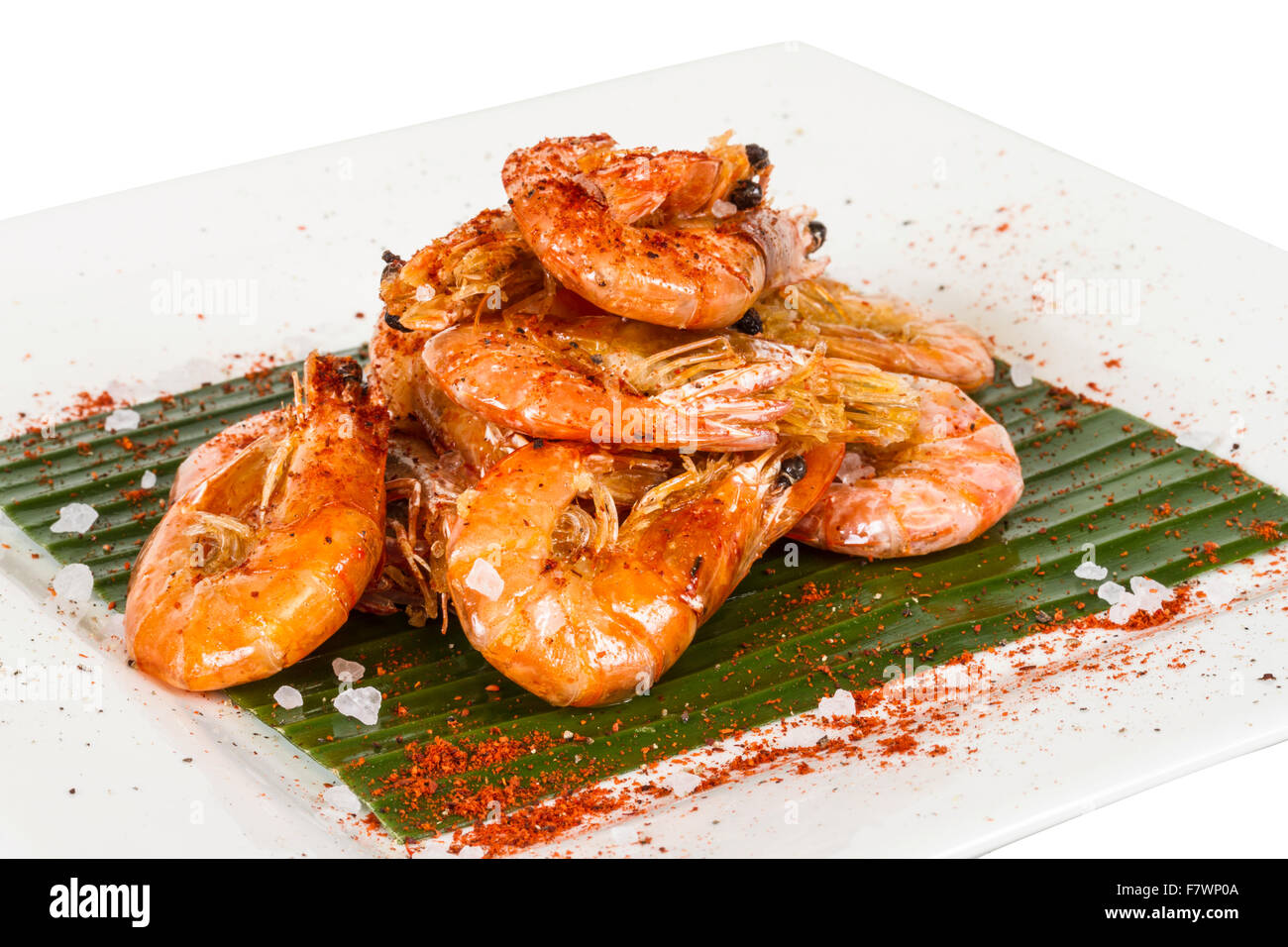 fried black tiger prawns with herbs and spices on banana leaf Stock ...