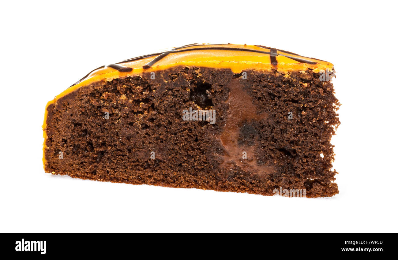 Piece of chocolate cake with icing on white isolated background Stock ...