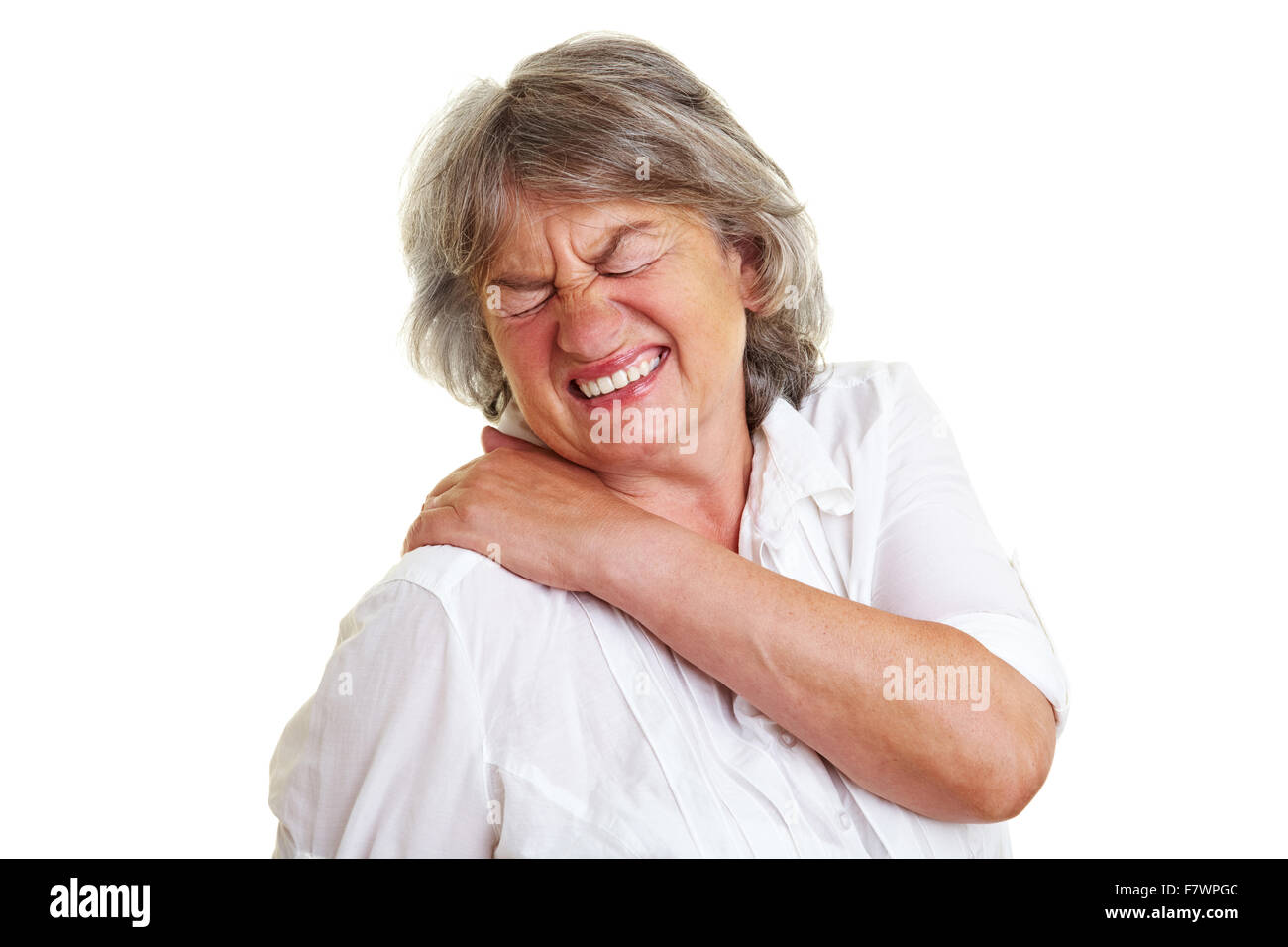 Elderly woman with gray hair holding her aching back Stock Photo - Alamy