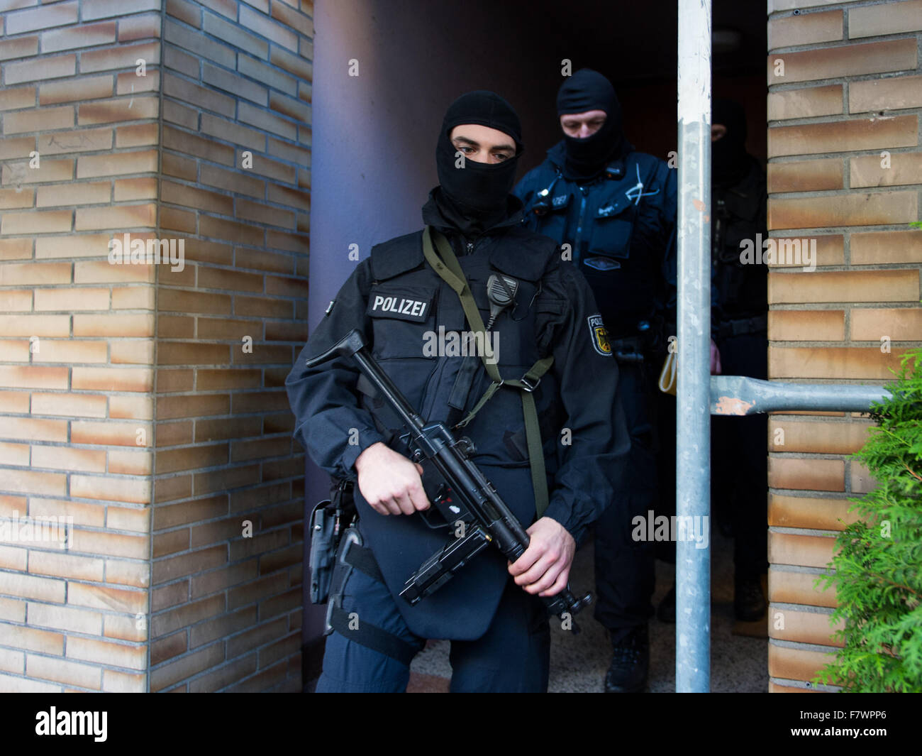 Duesseldorf, Germany. 03rd Dec, 2015. Masked police officers armed with ...