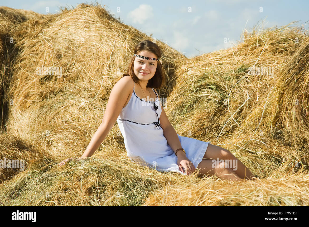 Girl barn farm fashion hay bales hi-res stock photography and images ...