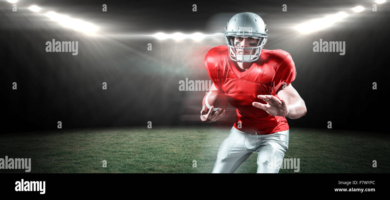 Composite image of portrait of defensive sportsman holding american ...