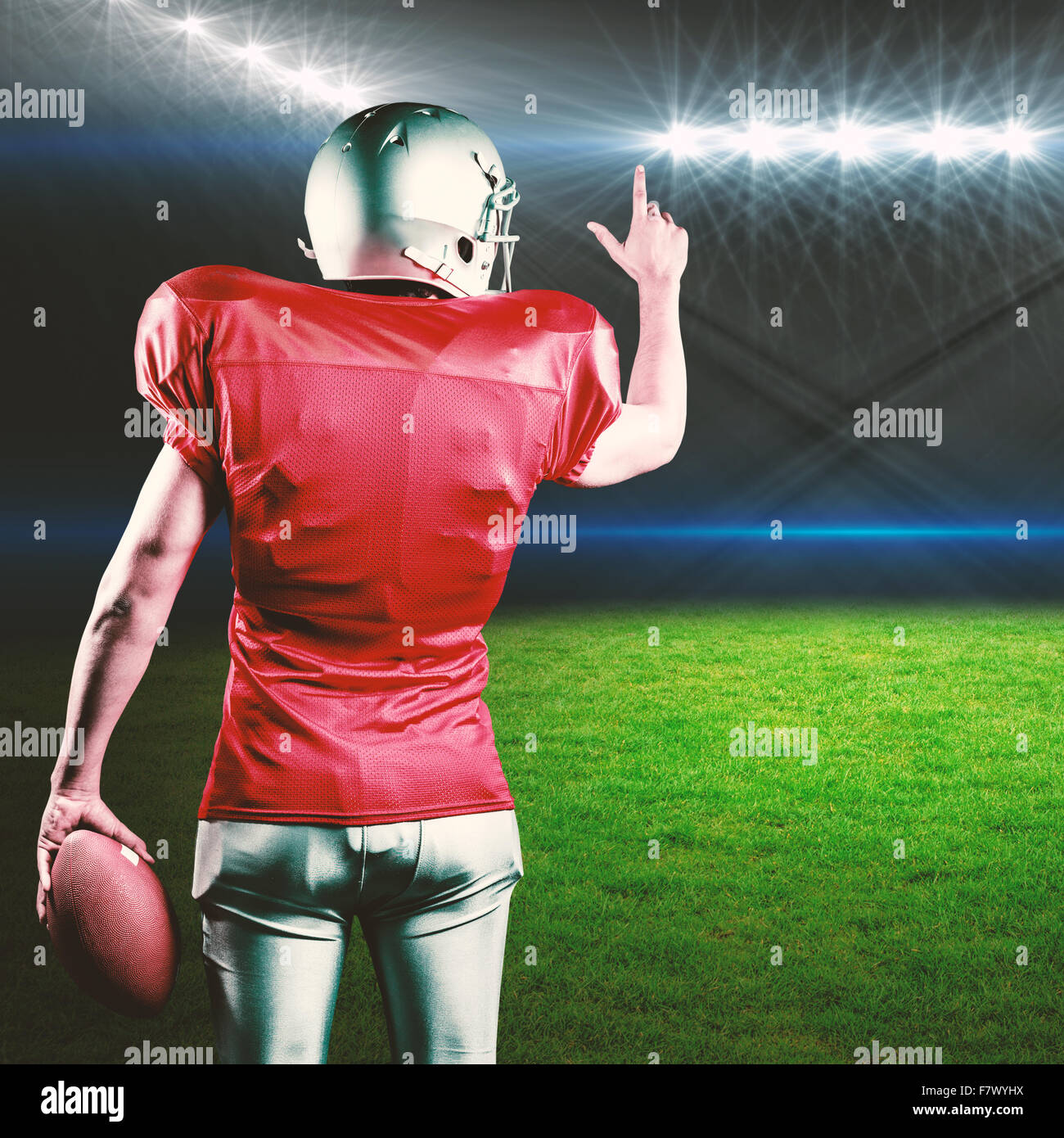 Composite image of rear view of american football player pointing while ...
