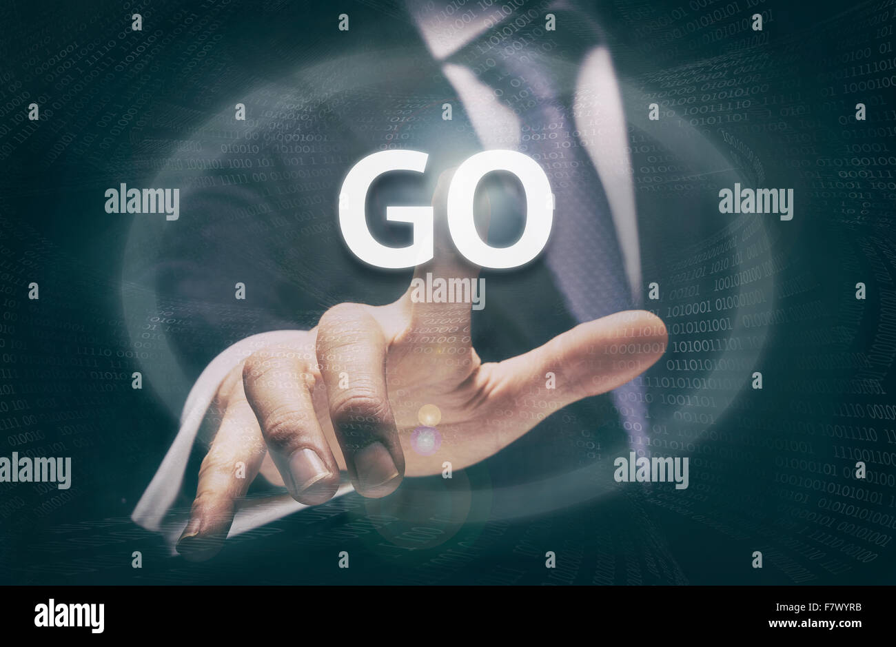 Businessman pressing a Go concept button Stock Photo - Alamy