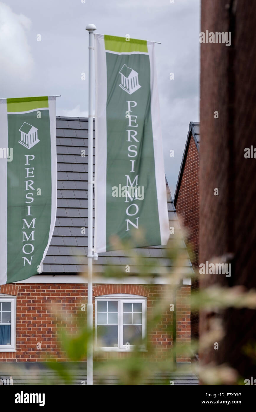 Persimmon housing development flags with Company name Stock Photo - Alamy