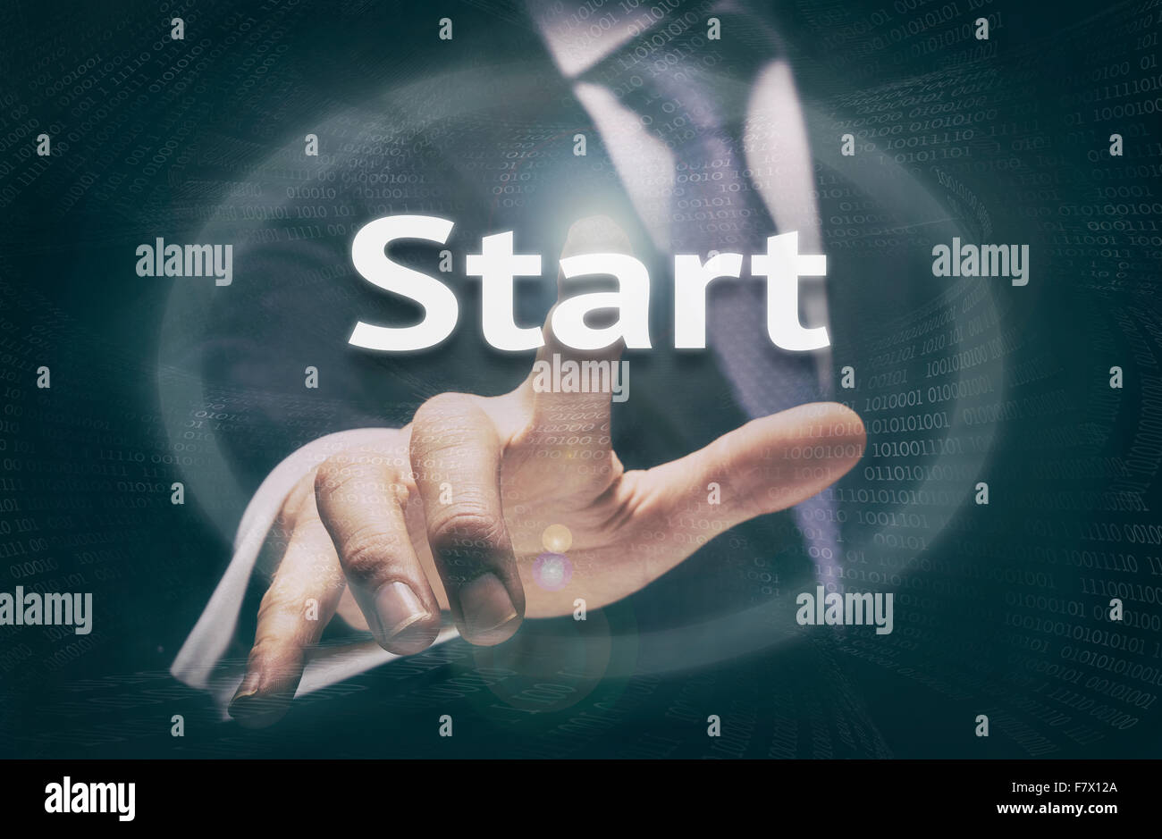 Businessman pressing a Start concept button Stock Photo - Alamy