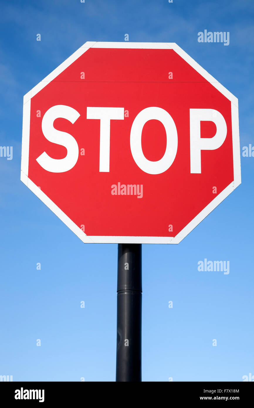 Red Stop Traffic Sign on Blue Sky Background Stock Photo - Alamy