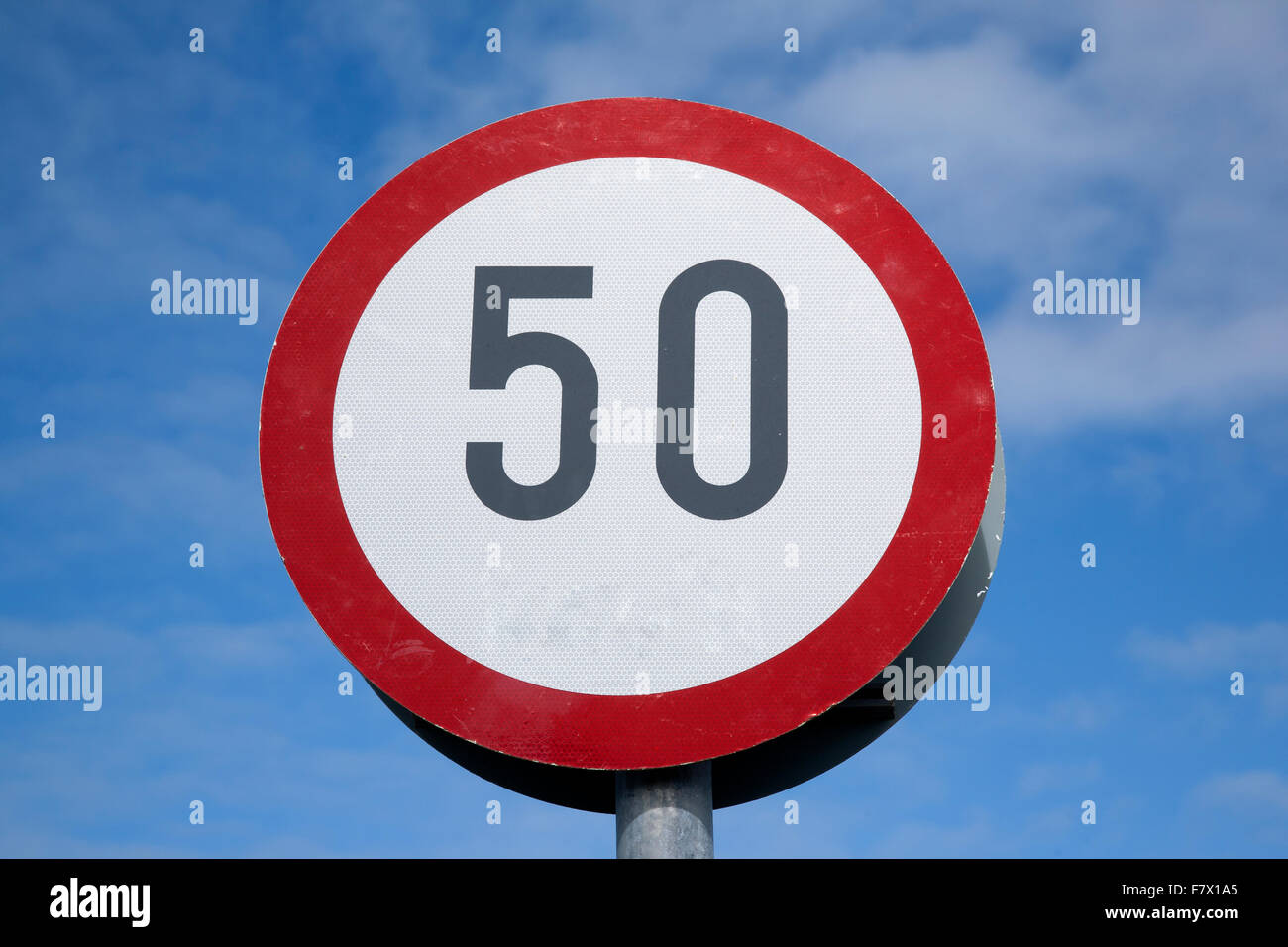 Fifty Traffic Speed Limit Sign on Blue Sky Background Stock Photo - Alamy