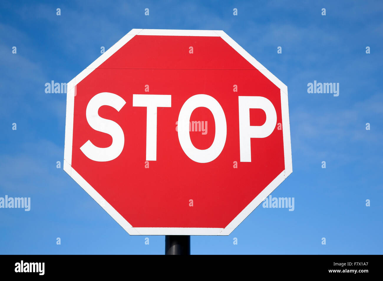 Red Stop Traffic Sign on Blue Sky Background Stock Photo - Alamy