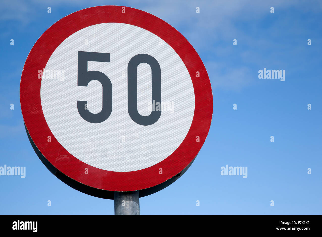 Fifty Traffic Speed Limit Sign on Blue Sky Background Stock Photo - Alamy