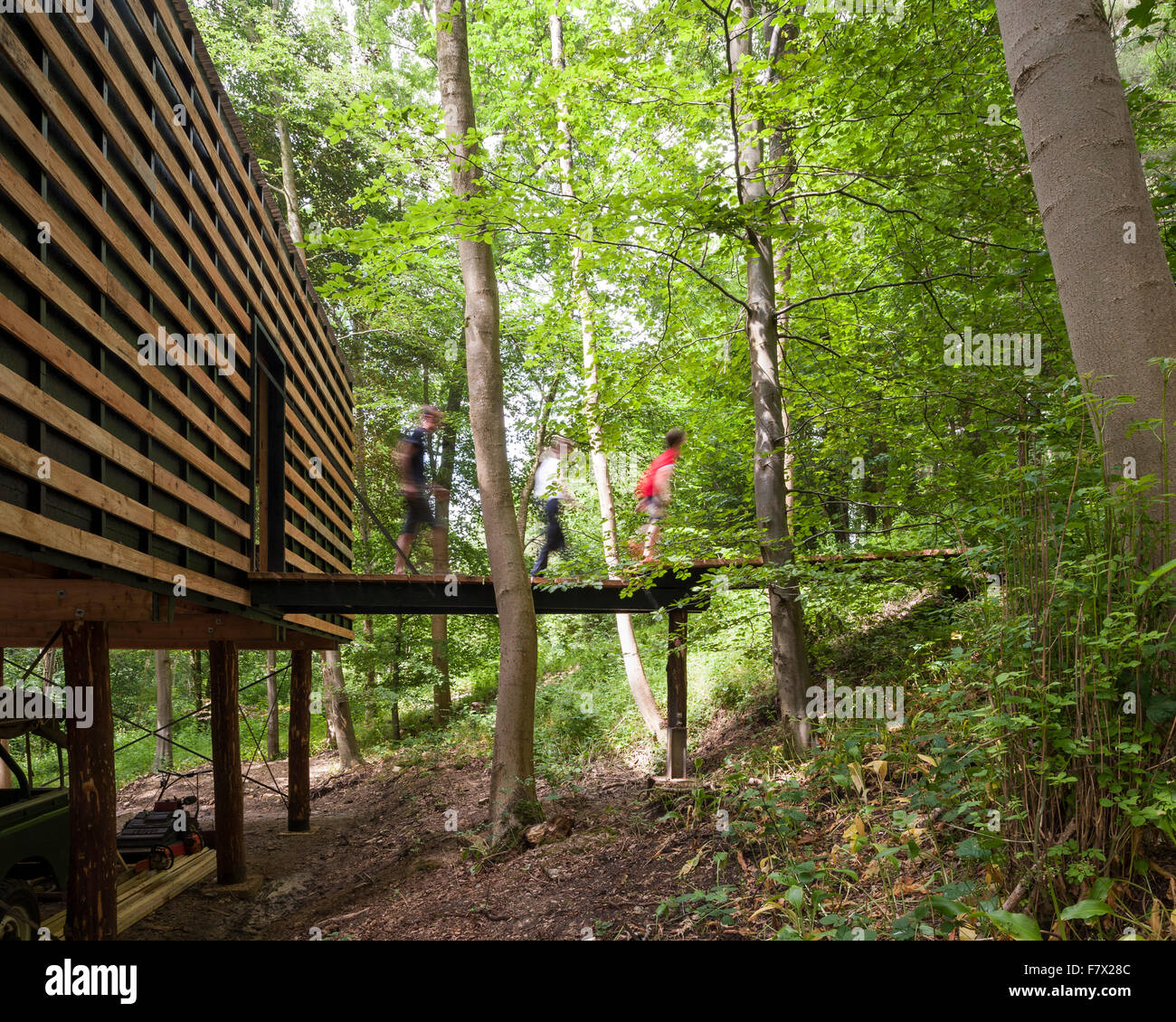 View of bridge connection from lower level with people crossing over ...