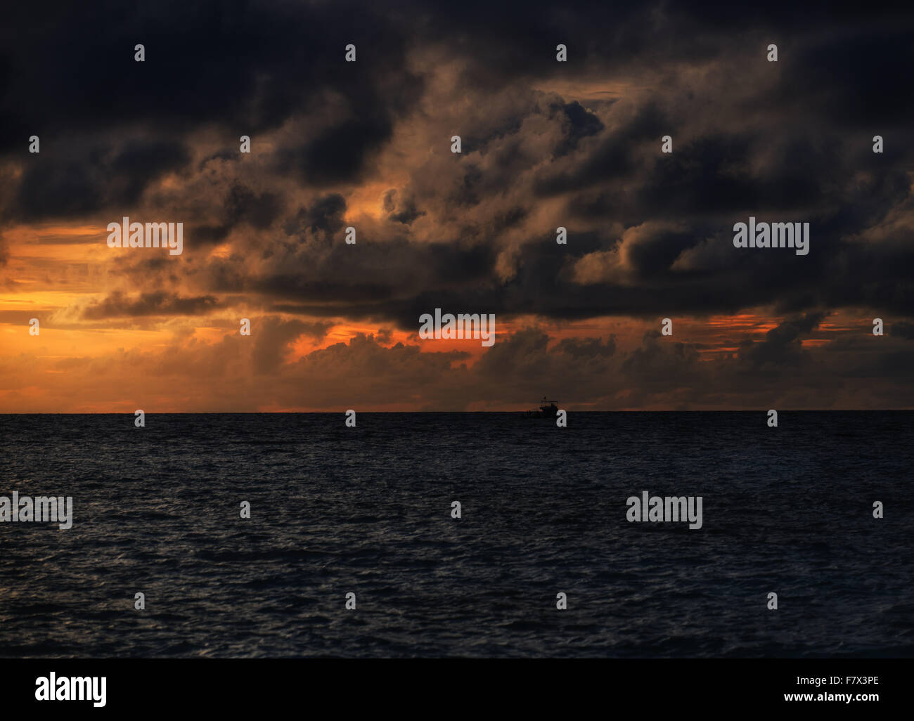 Storm clouds over seascape, Maldives Stock Photo - Alamy