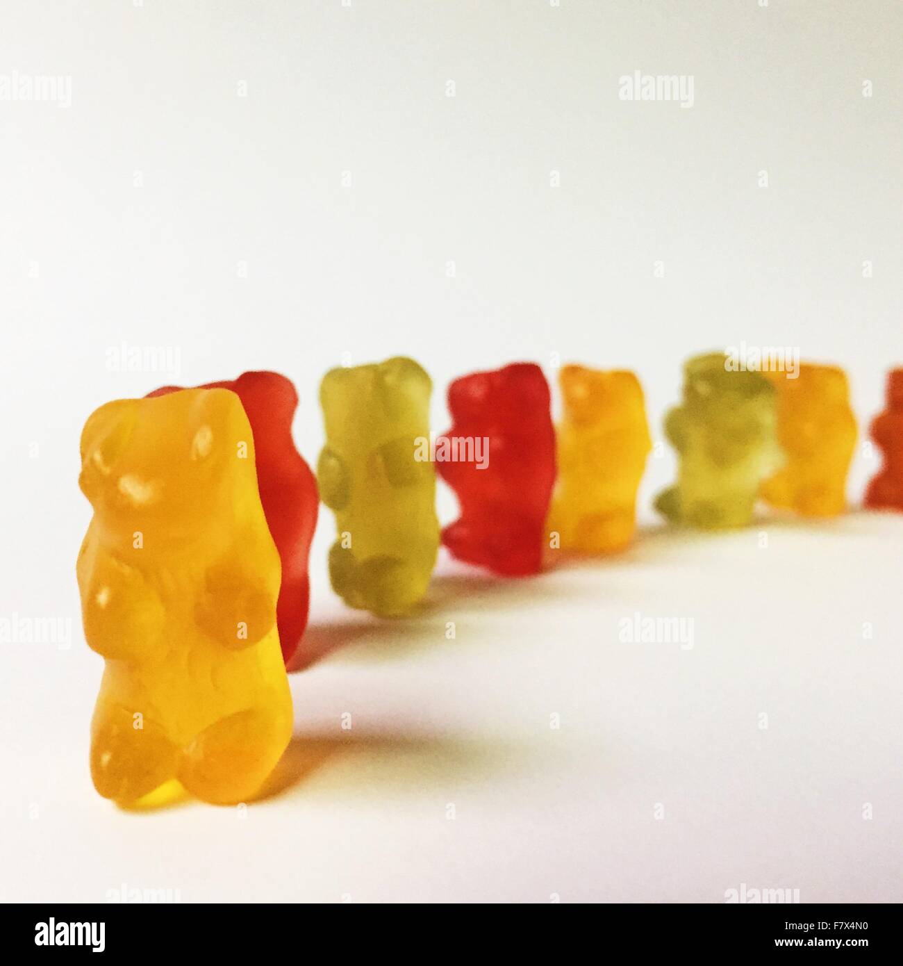 Colorful gummy bears lined up in a circle Stock Photo - Alamy