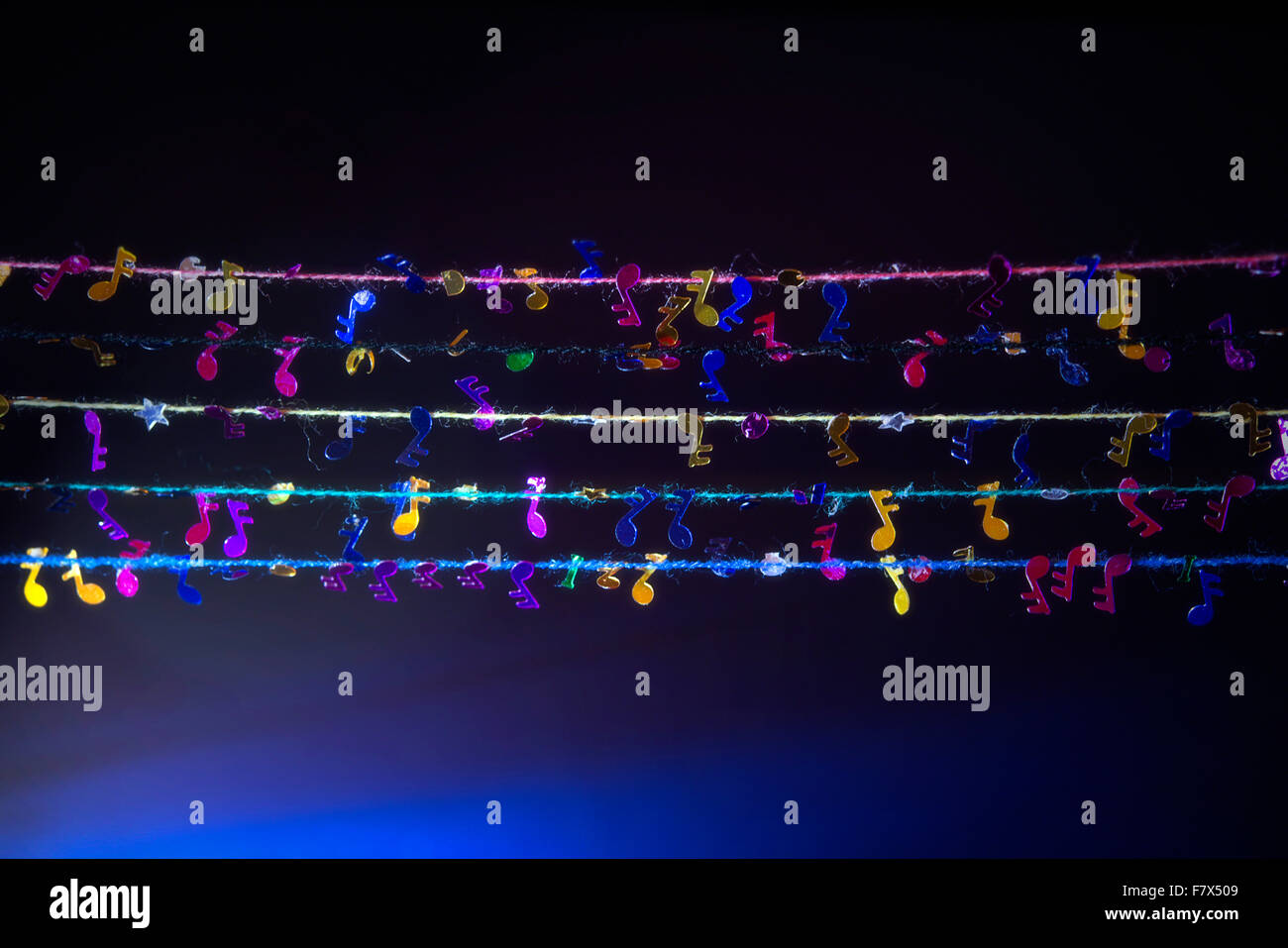 Musical notes hanging on clothes lines Stock Photo - Alamy