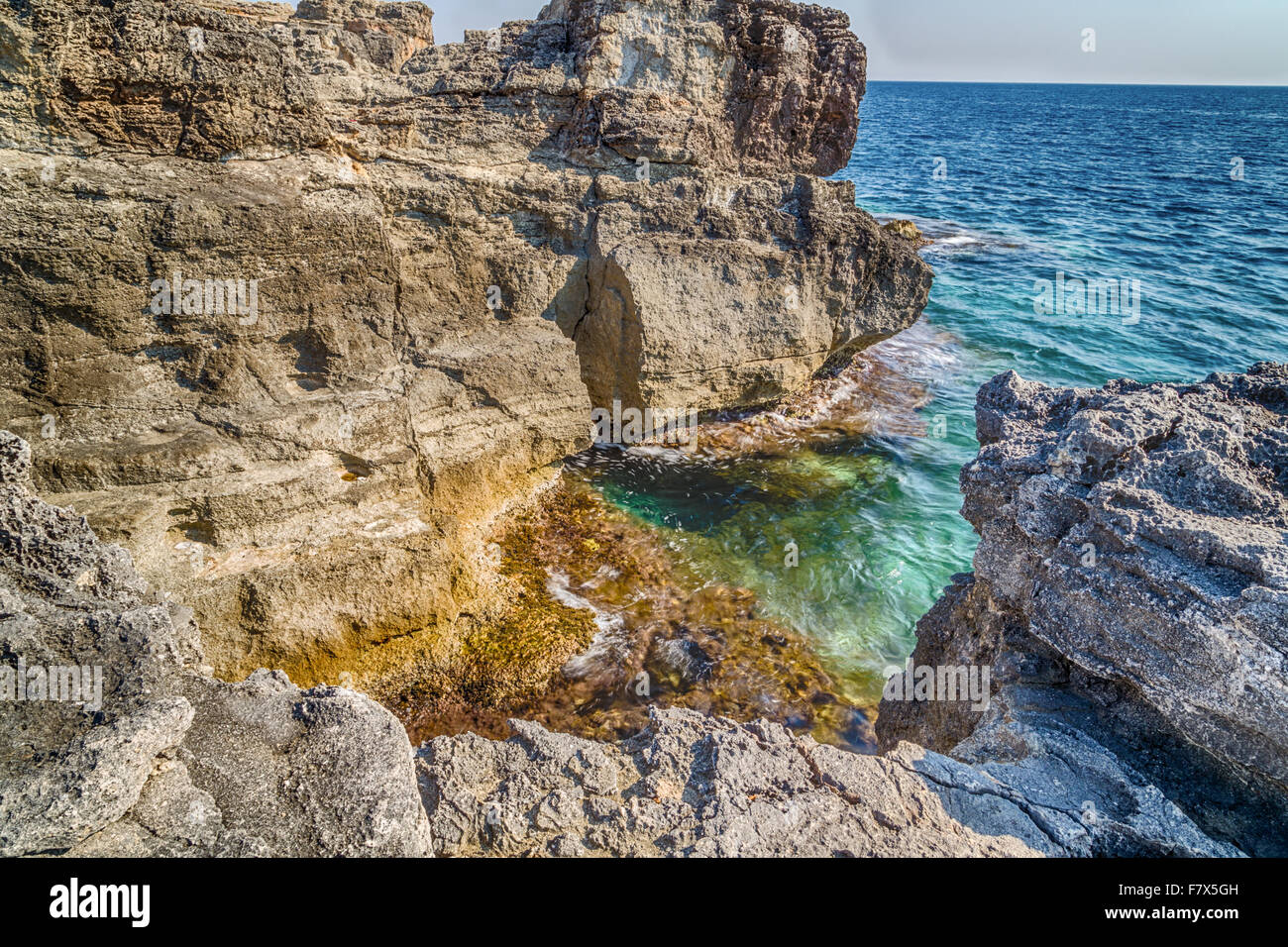 rocks and coves of the coast of Salento of the Ionian Sea in Italy ...