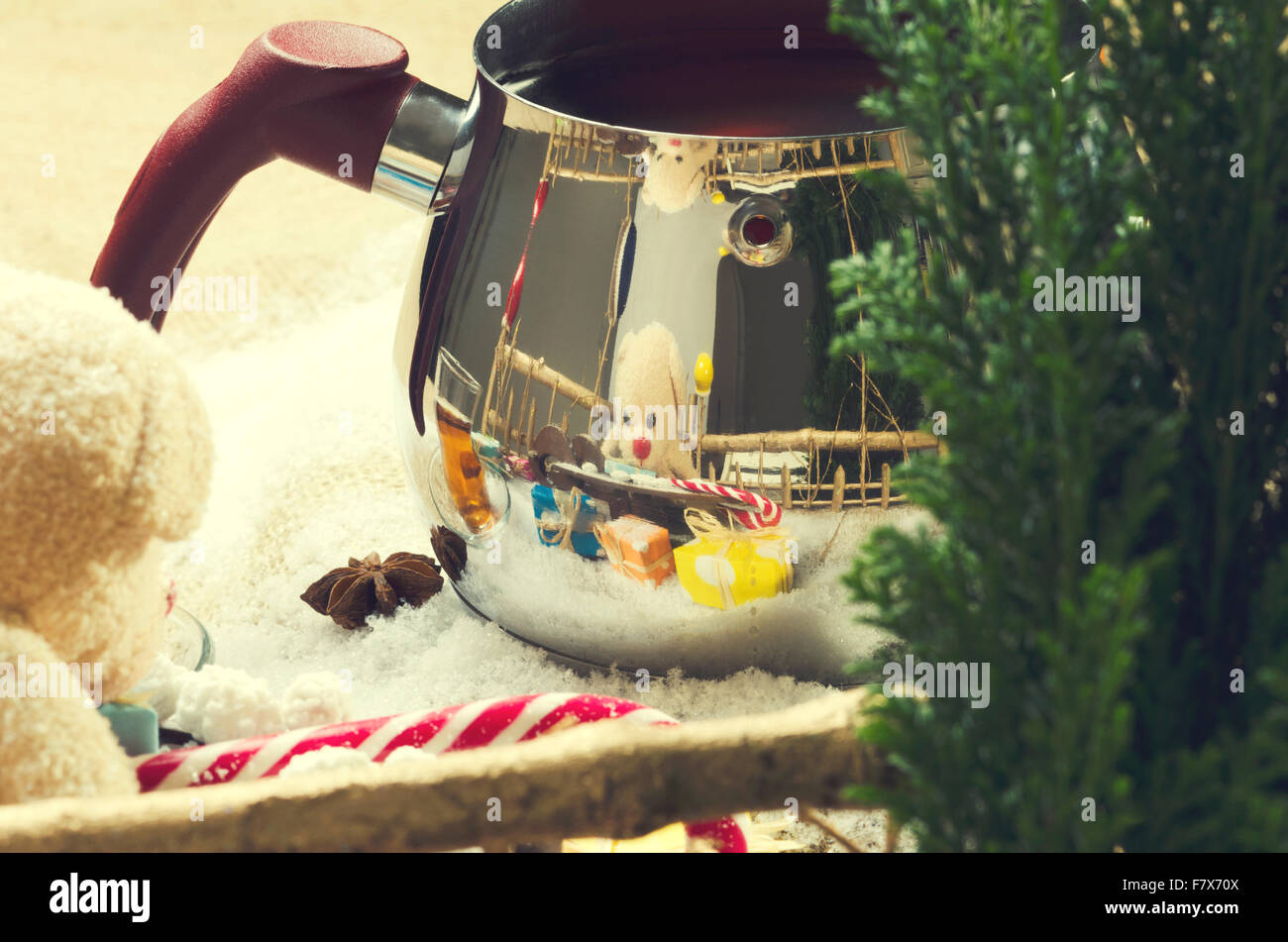 Christmas tea pot with teddy bear reflection Stock Photo - Alamy