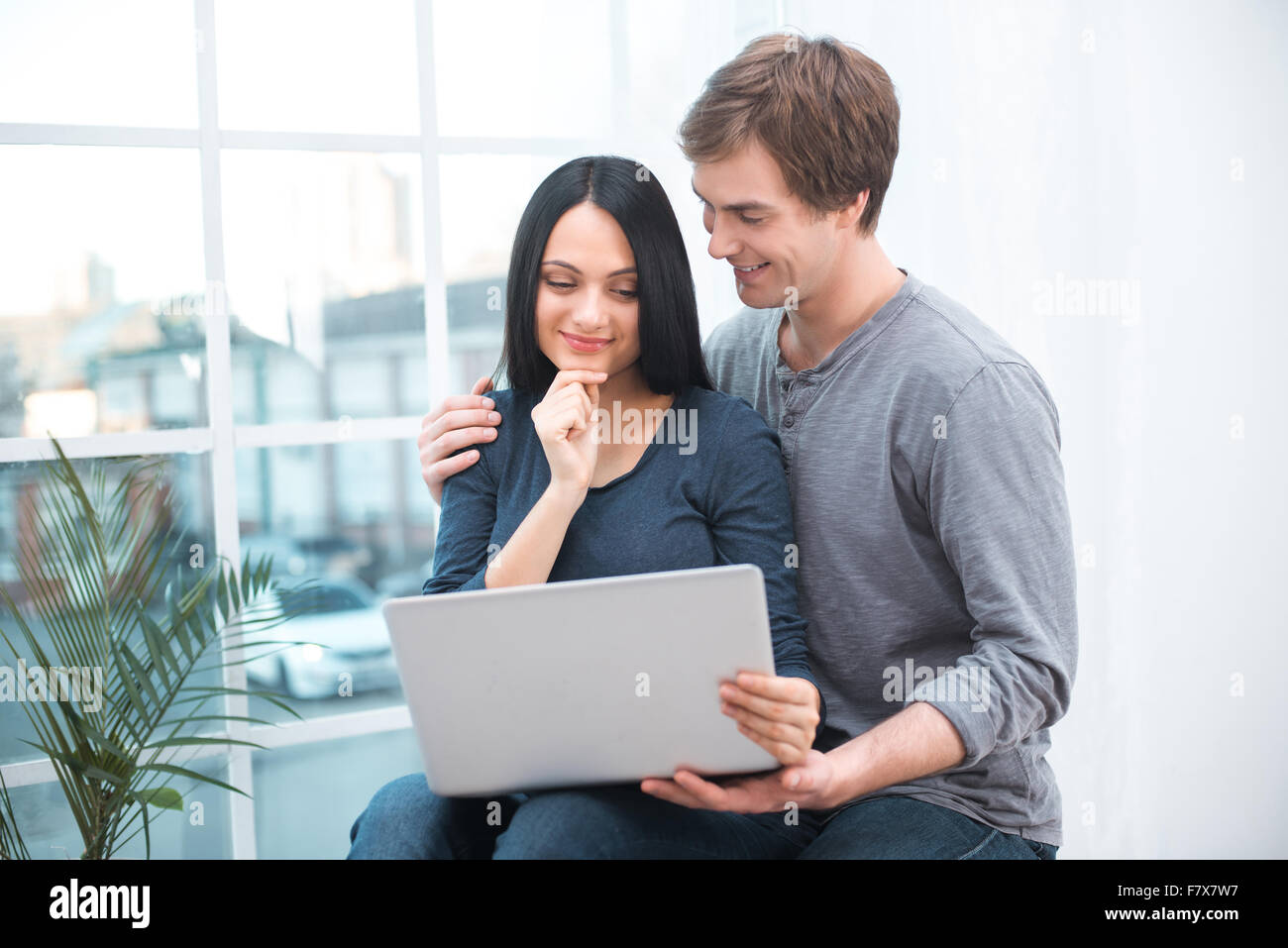 Young beautiful couple at home Stock Photo - Alamy