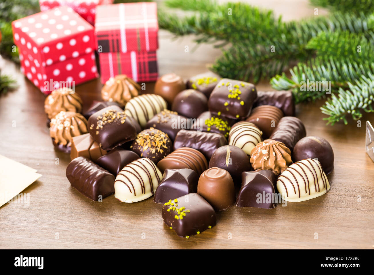Wrapping assorted chocolates in small boxes for Christmas presents ...