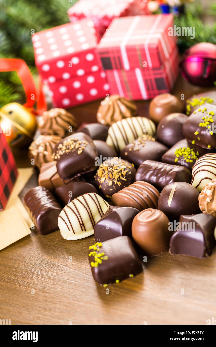 Wrapping assorted chocolates in small boxes for Christmas presents ...