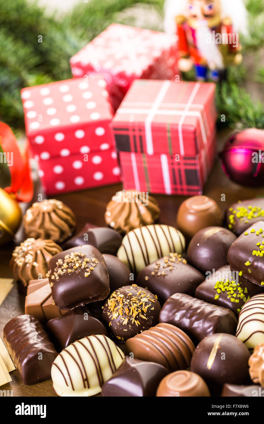 Wrapping assorted chocolates in small boxes for Christmas presents ...