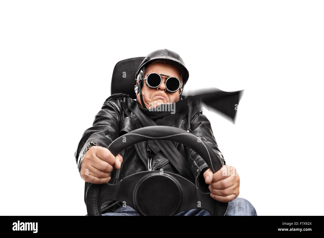 Senior man in black leather jacket and goggles driving very fast seated ...