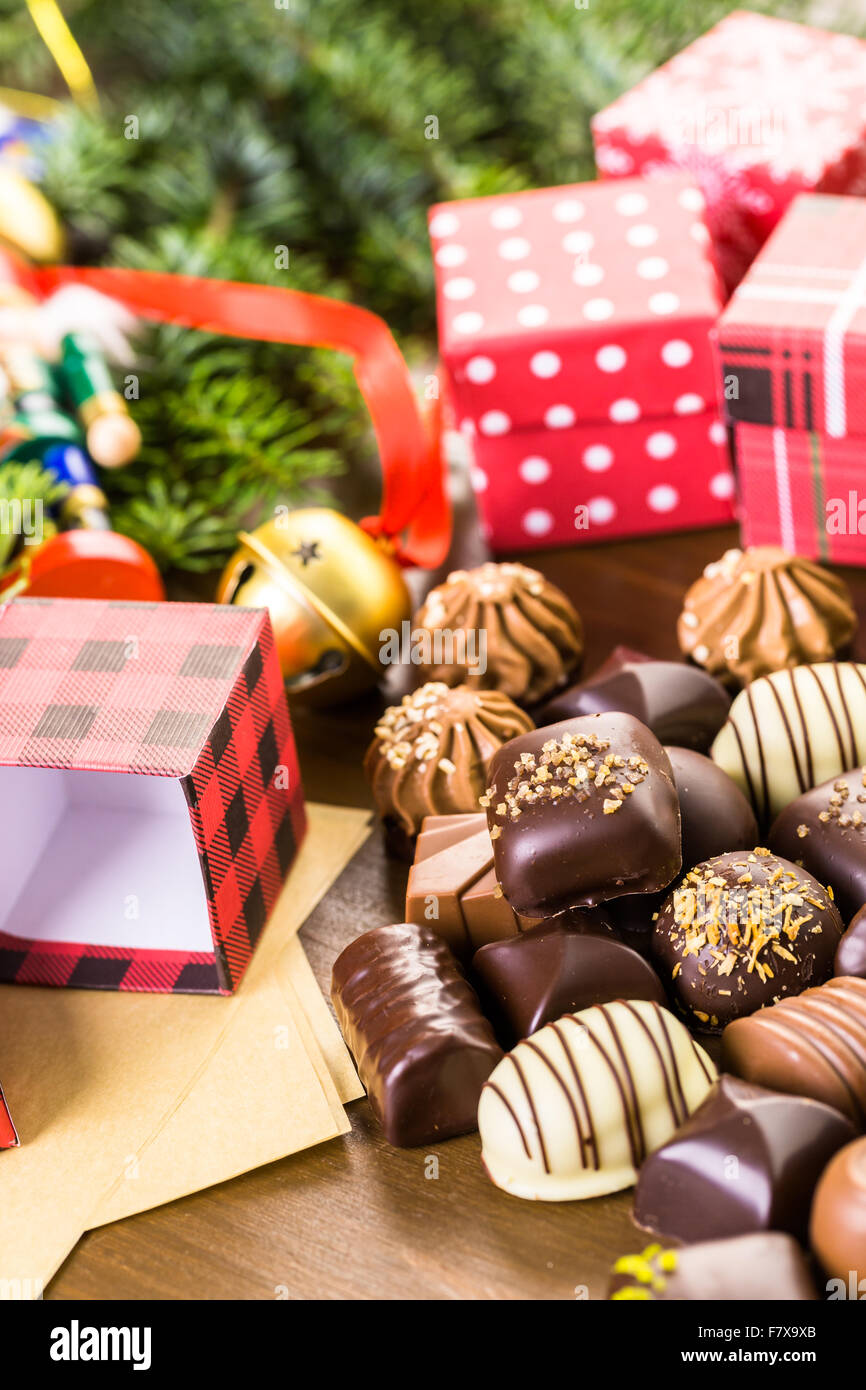 Wrapping assorted chocolates in small boxes for Christmas presents ...