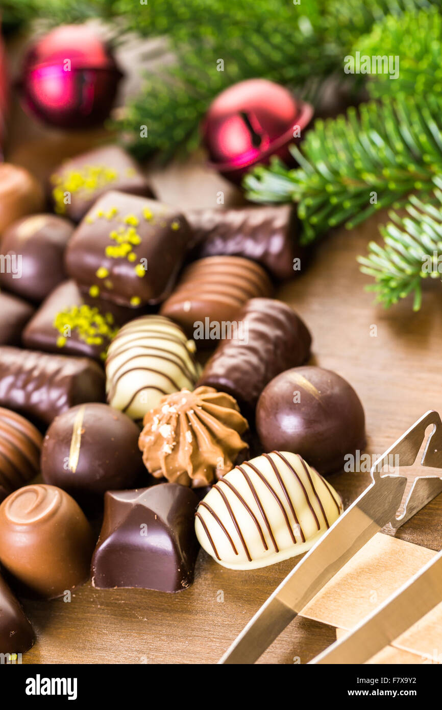 Wrapping assorted chocolates in small boxes for Christmas presents ...
