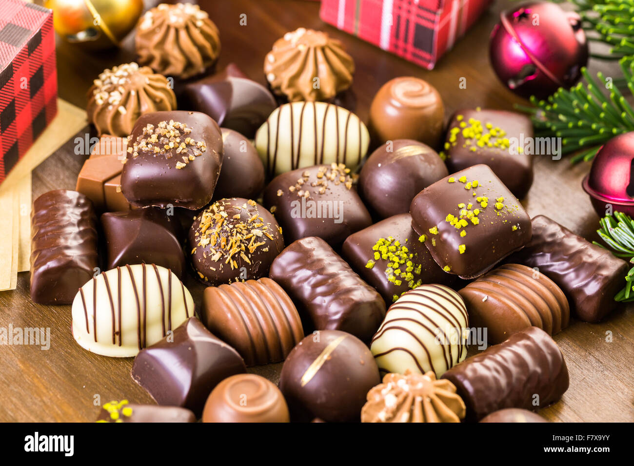 Wrapping assorted chocolates in small boxes for Christmas presents ...