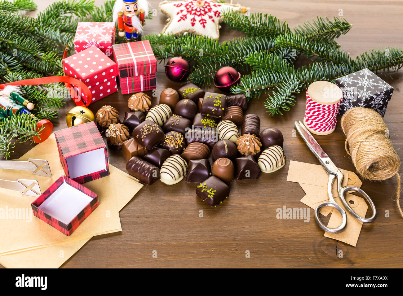 Wrapping assorted chocolates in small boxes for Christmas presents ...