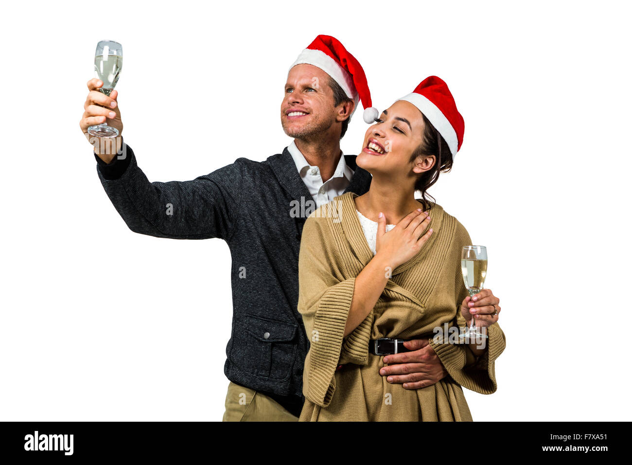 Elegant couple celebrating christmas together Stock Photo - Alamy