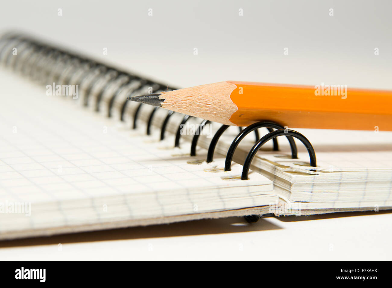 Opened notebook with a blank sheet and pencil on over white Stock Photo ...