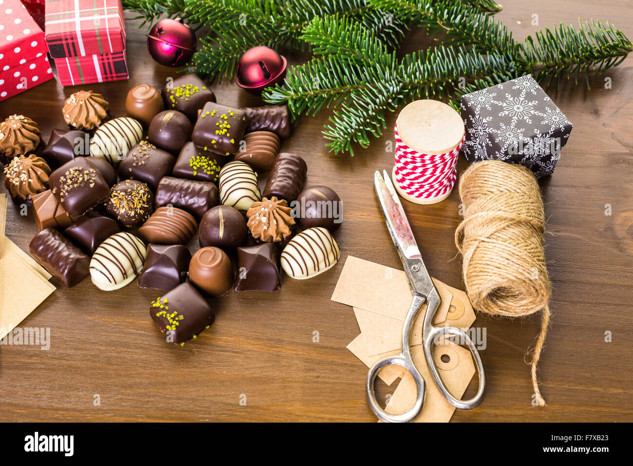 Wrapping assorted chocolates in small boxes for Christmas presents ...