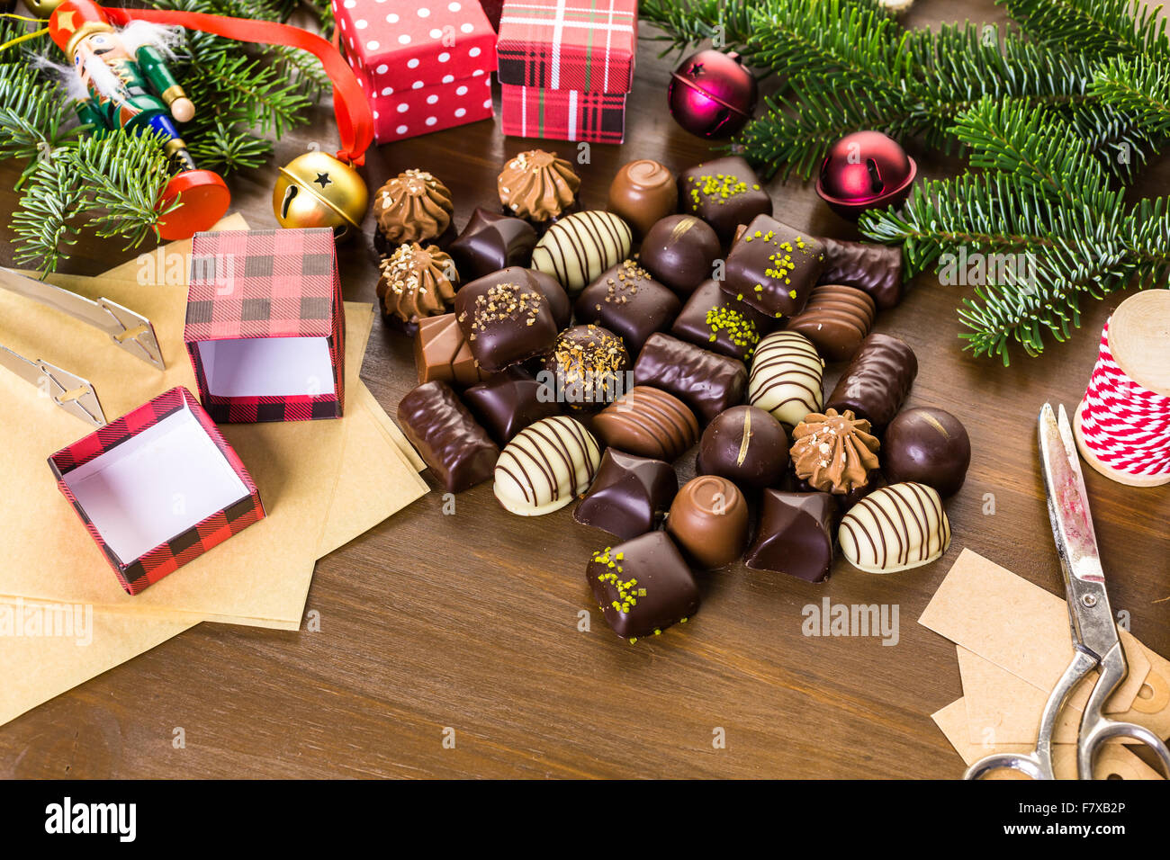 Wrapping assorted chocolates in small boxes for Christmas presents ...