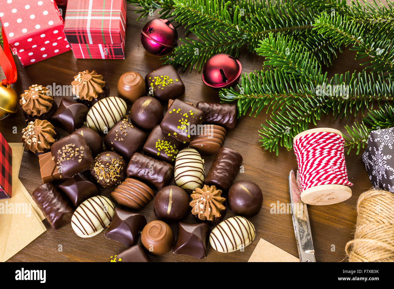 Wrapping assorted chocolates in small boxes for Christmas presents ...