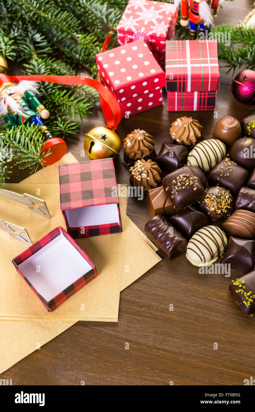 Wrapping assorted chocolates in small boxes for Christmas presents ...