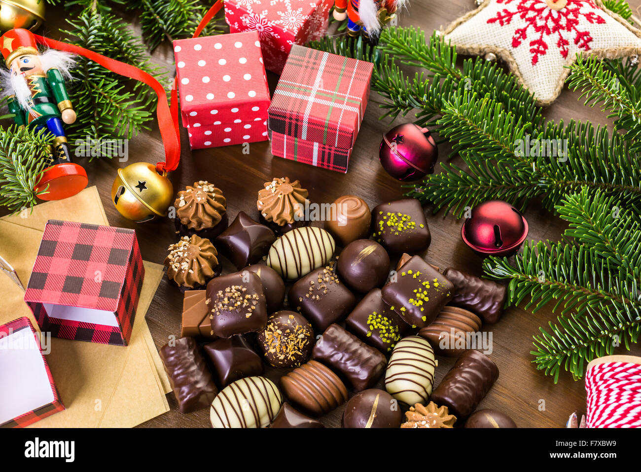 Wrapping assorted chocolates in small boxes for Christmas presents ...