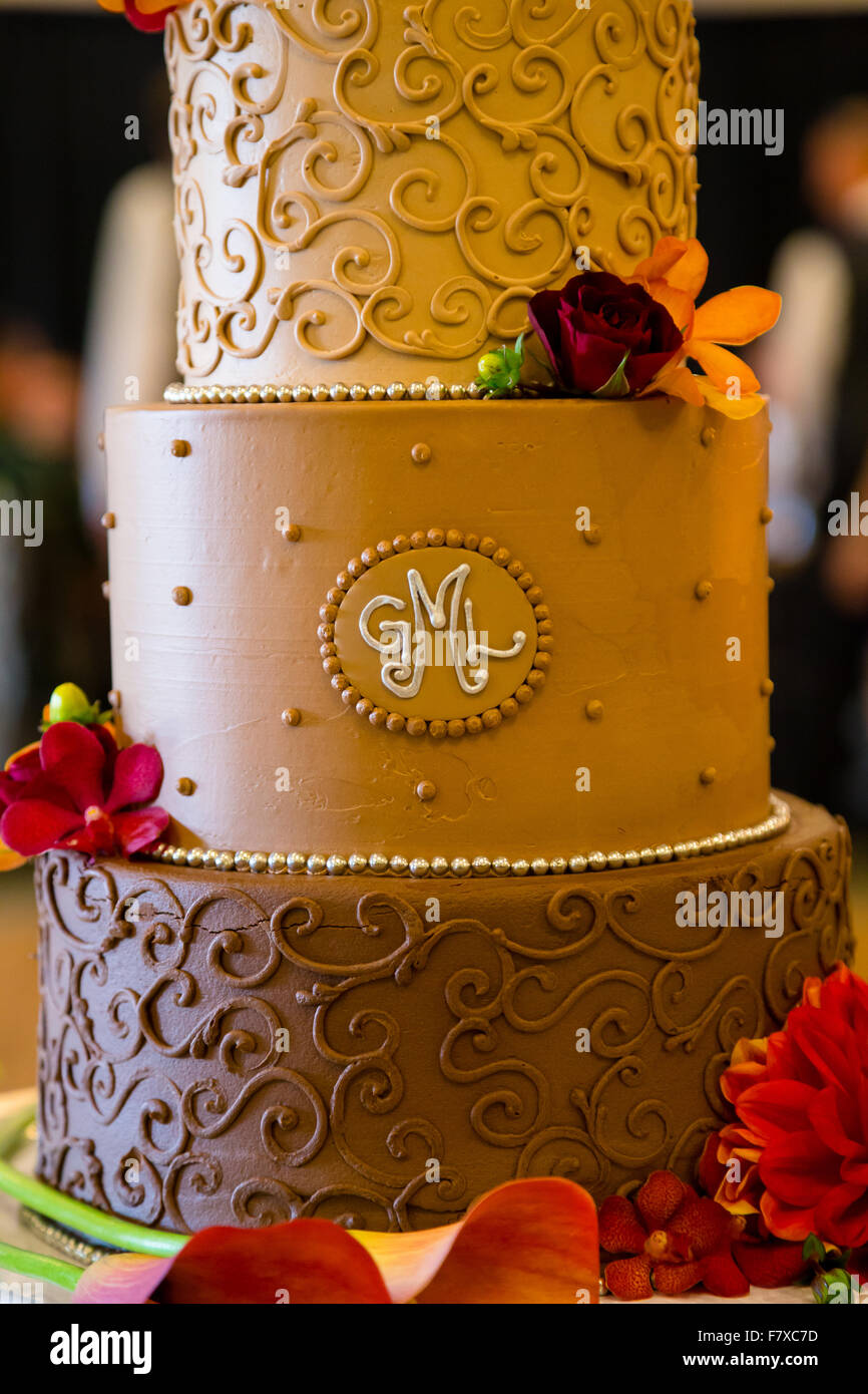 Wedding cake at a reception with a custom design for the bride and ...