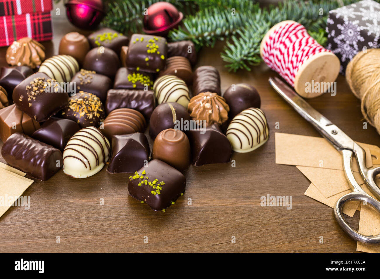 Wrapping assorted chocolates in small boxes for Christmas presents ...