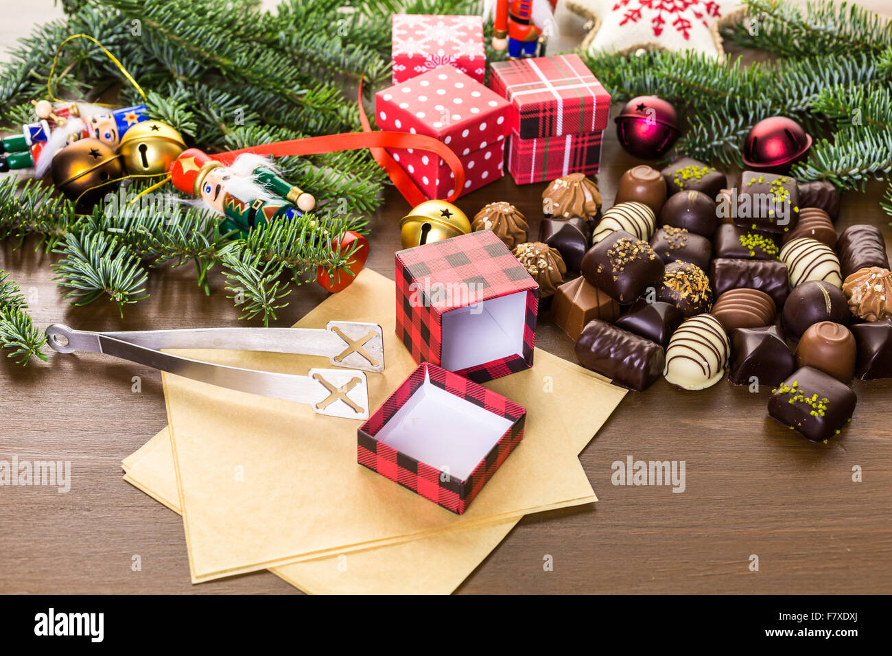 Wrapping assorted chocolates in small boxes for Christmas presents ...