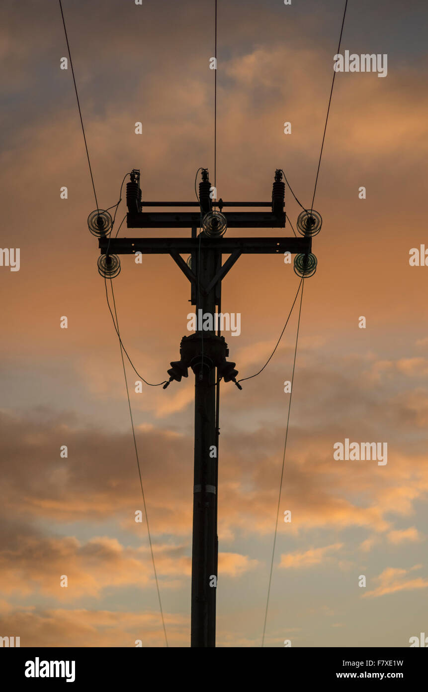 Telegraph pole at sunset Stock Photo - Alamy